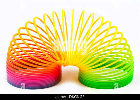 Slinky Toy isolated over a plain white background Stock Photo - Alamy