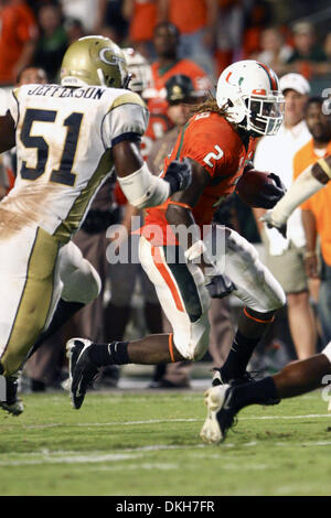 Miami Hurricanes running back Graig Cooper (2) gets past Georgia Tech ...
