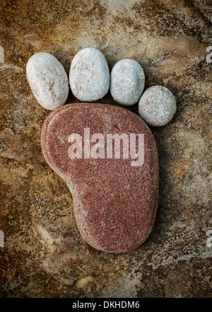 A foot shape with toes made of stones Stock Photo - Alamy