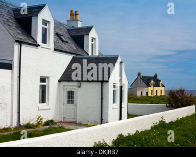 Traditional white painted crofters cottages at Mannal on the Isle of ...