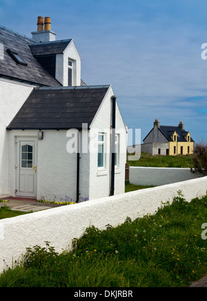 Traditional white painted crofters cottages at Mannal on the Isle of ...