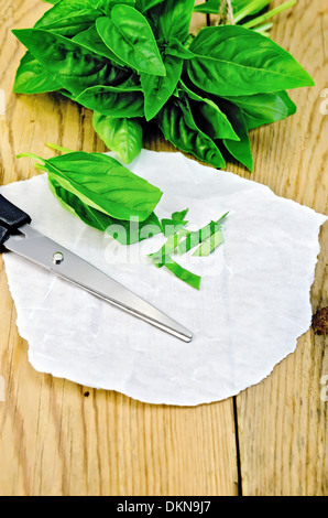 Scissors on wooden boards background Stock Photo - Alamy