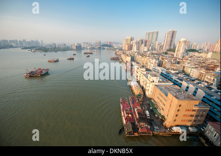 A bird's view of Macau's old inner port with quay buildings and ships ...