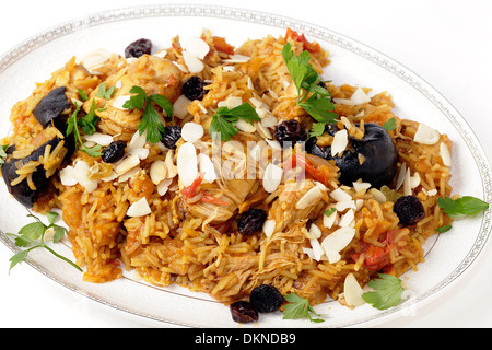 An authentic Saudi chicken kabsa (known in Qatar as majbous), garnished ...