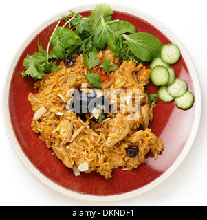 An authentic Saudi chicken kabsa (known in Qatar as majbous), garnished ...