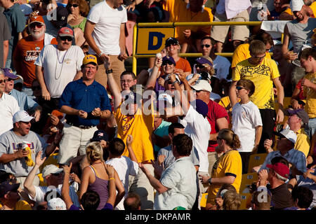 A fan catches the ball during the World Cup Group L soccer match ...