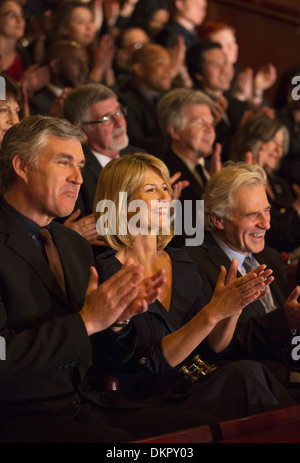 Clapping theater audience Stock Photo - Alamy