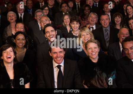 Laughing theater audience Stock Photo - Alamy