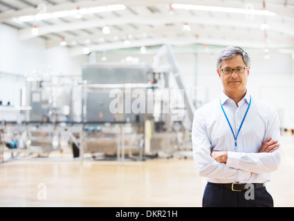 Portrait of a confident businessman in a factory Stock Photo - Alamy