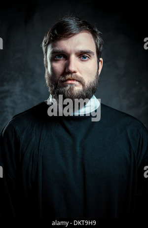 Priest religion man thinking and looking up expressing doubt and wonder ...