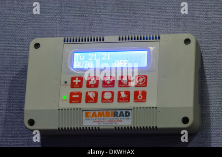 Central heating programmable timer control unit on white background ...