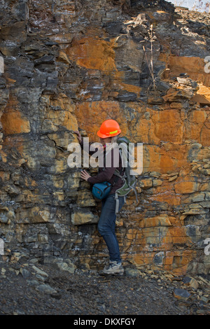 Female Geologist examining Marcellus shale, near Marcellus New York ...