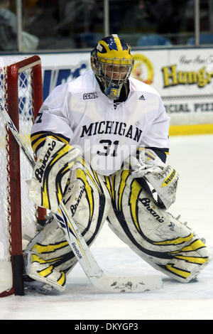 Michigan Goalie Shawn Hunwick (31) and Notre Dame Center Kevin Deeth ...