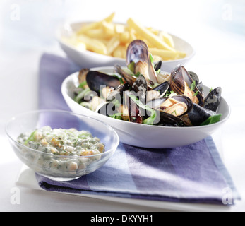 Delicious marinated mussels in bowl on rustic concrete background ...
