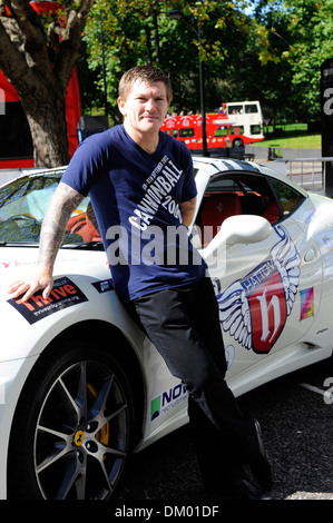 Ricky Hatton stands beside a Ferrari California at Cannonball 2000 ...