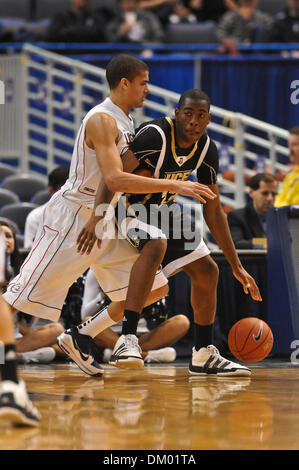 Central Florida's Keith Clanton (33) and Marcus Jordan (5) stop the ...