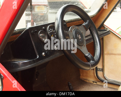 The red Tomcar is a compact off-road vehicle known for its rugged ...