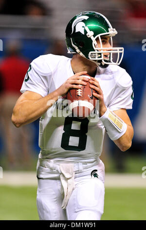 Michigan State quarterback Kirk Cousins drops off the ball against ...