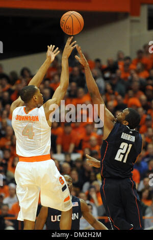 Connecticut forward Stanley Robinson (21) dunks the ball after catching ...