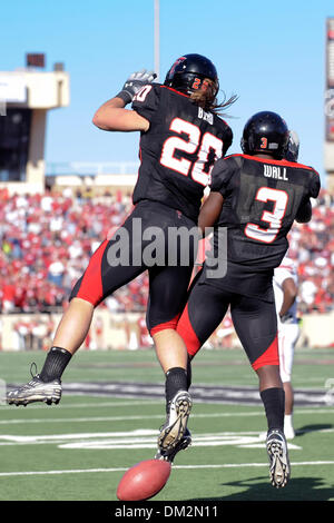 Texas Tech LB Bront Bird (20) looks to stop RB Demarco Murray (7) as ...