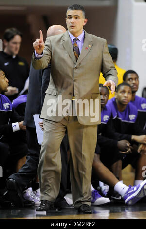 Kansas State coach Frank Martin cheers on his team in the first half ...