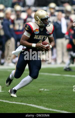 Navy quarterback Ricky Dobbs #4 with the Texas Bowl MVP trophy during ...