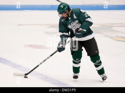 Michigan State Defenseman Matt Grassi (23) and Notre Dame Right Wing ...