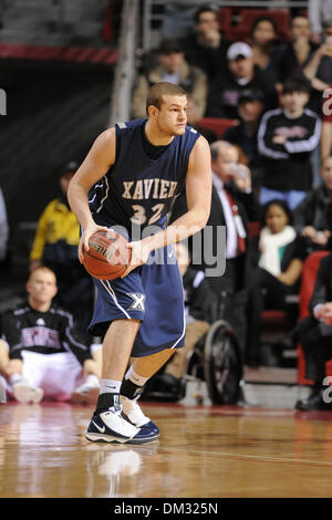 Xavier center Kenny Frease #32 shoots over Temple forward Craig ...