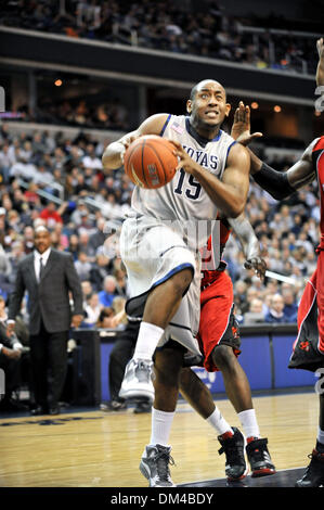 Georgetown guard Austin Freeman #15 passes the ball while being guarded ...