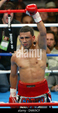 Miguel Cotto, of Puerto Rico, celebrates after beating Michael Jennings ...