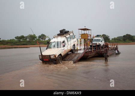 Cars of MSF crossing a river in central african republic Stock Photo ...