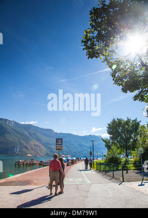 Cycling path and cyclists around Lake Annecy, Savoie, France Stock ...