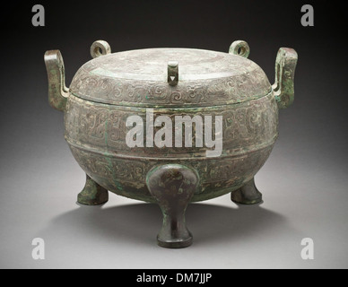 This ritual food cauldron, or Ding, is adorned with interlaced dragon ...
