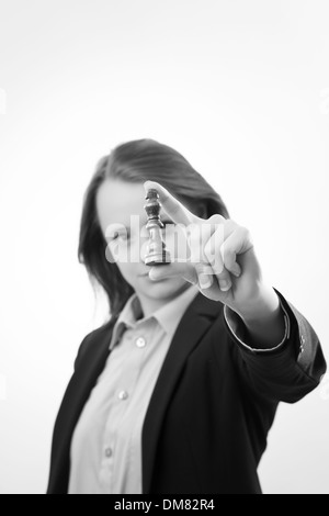 Confident business woman playing chess at the table. Intellectual duel ...