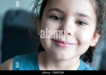 Portrait of caucasian girl of six years looking at camera on white ...