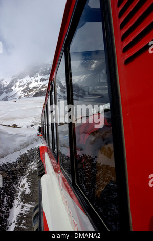 Snow Coach tour bus at the Athabasca Glacier. The Athabasca is the most ...