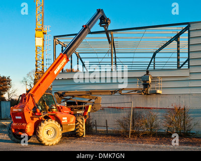 Manitou mobile cranes / metal cladding panels being fitted on factory ...
