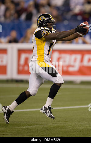 Hamilton Tiger-Cats running back Treshaun Ward (39) tries to move past ...