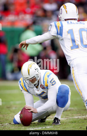 San Diego Chargers punter Mike Scifres (5) holds the ball for kicker ...