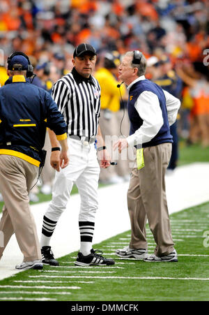 West Virginia head coach Bill Stewart gets a hug from Sammy Morrone (86 ...