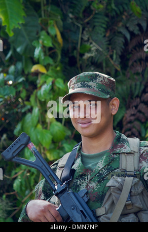 Soldier posing with weapon Stock Photo - Alamy