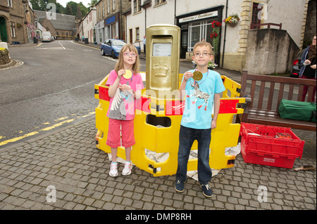 Freya Fleming and her brother Ruari of Dunblane A postbox is painted ...