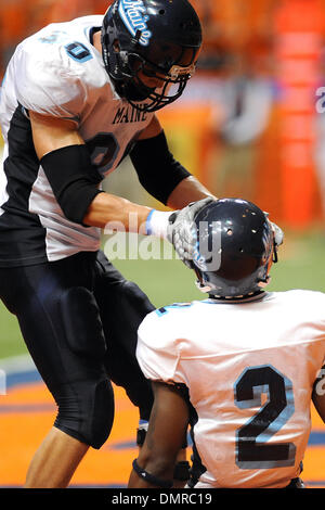 Maine tight end Derek Buttles (80) turns up field near the sideline in ...