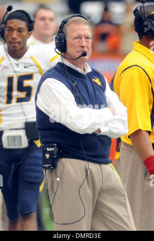 West Virginia head coach Bill Stewart gets a hug from Sammy Morrone (86 ...