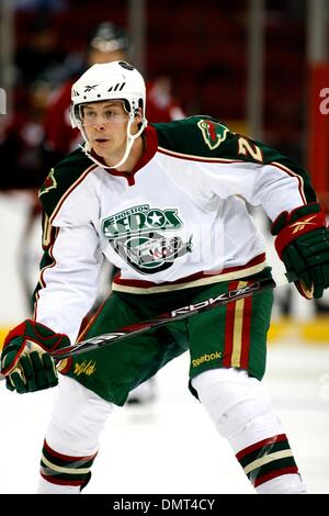 Houston Aeros Center Chad Rau (20) brings the puck ice to the Griffins ...