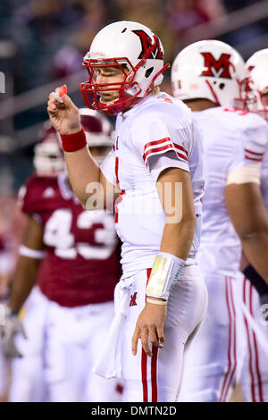 Miami RedHawks quarterback Zac Zysert (4) dropping back to pass during ...