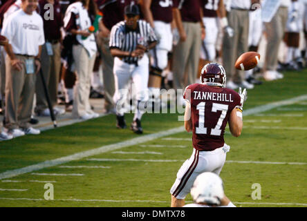 Ryan Tannehill 17 of the Texas A M University Aggies catches a pass in front of the Aggie bench. Tannehill would later score a touchdown. The Texas A M Aggies defeated the Utah State Aggies 38 30 at K...