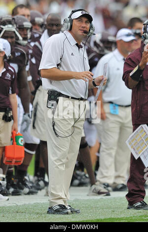 Mississippi State football coach Dan Mullen looks at his team during ...