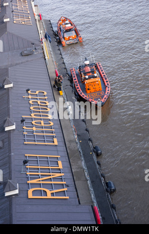 RNLI boats moored on the Thames at Chiswick lifeboat station Stock ...