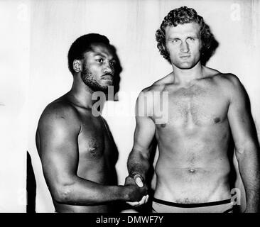Former heavyweight champion Joe Frazier pounds away at a side of beef ...